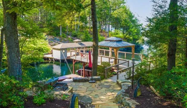 Lakefront home with granite counters, fireplace, lake views, & dock ...